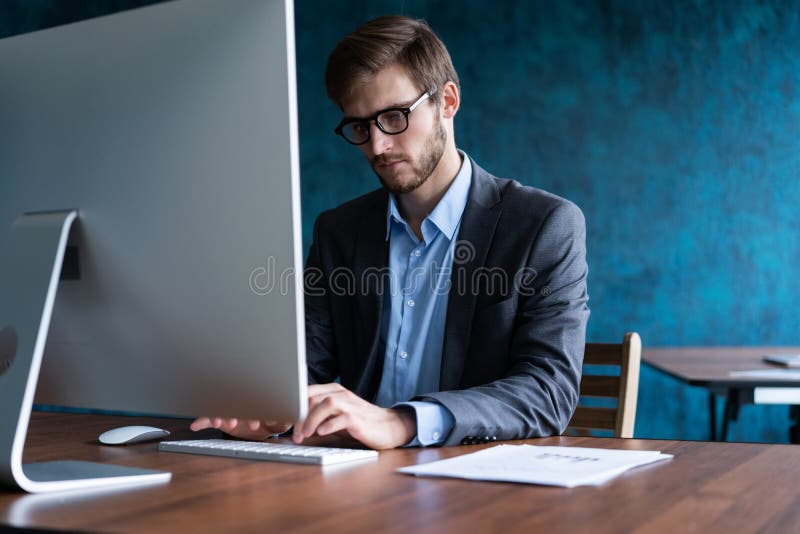 Man Working at Computer in Contemporary Office. Stock Photo - Image of ...