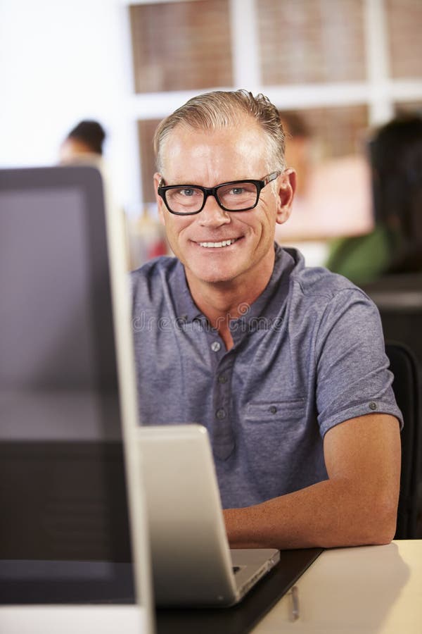 Man Working at Computer in Contemporary Office Stock Image - Image of ...