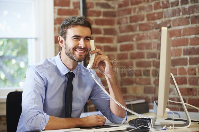 Man Working at Computer in Contemporary Office Stock Image - Image of ...