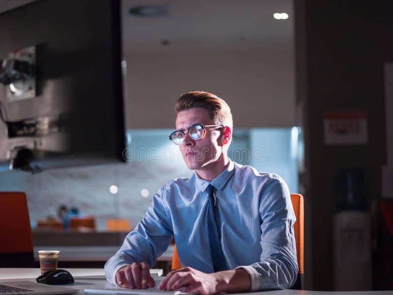 Man Working on Computer in Dark Office Stock Image - Image of internet ...
