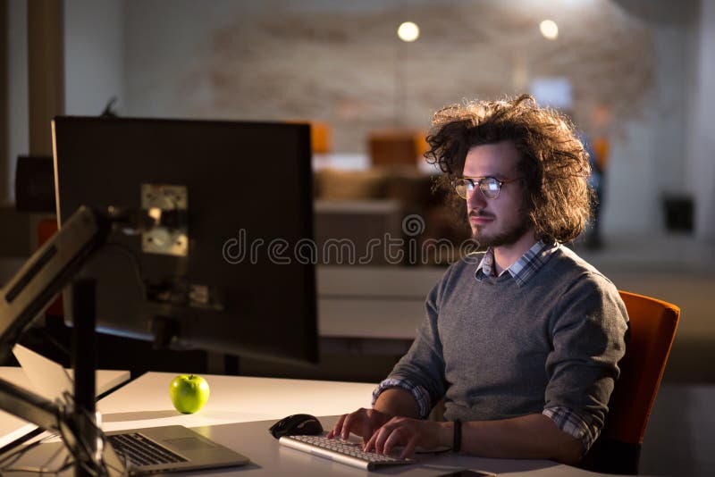 Man Working on Computer in Dark Office Stock Photo - Image of male ...