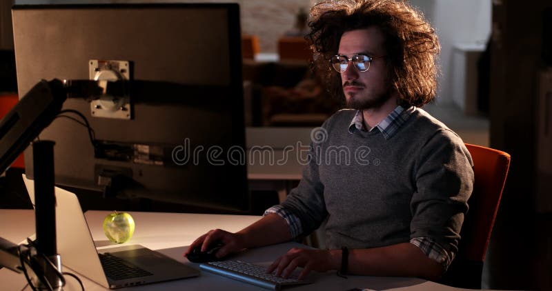 Man Working on Computer in Dark Office Stock Photo - Image of dark ...