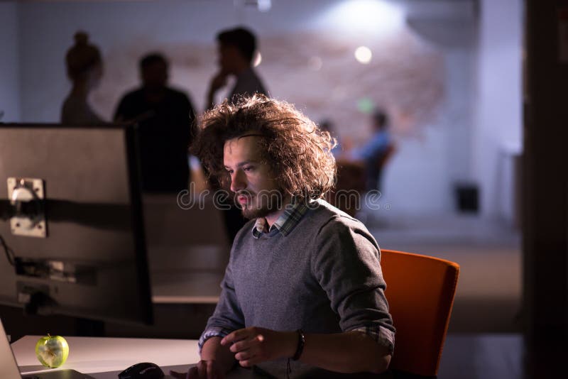 Man Working on Computer in Dark Office Stock Image - Image of office ...