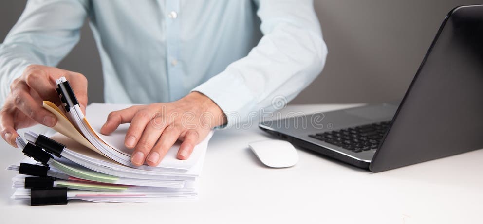 Man Working Computer and Stack of Documents Stock Photo - Image of ...
