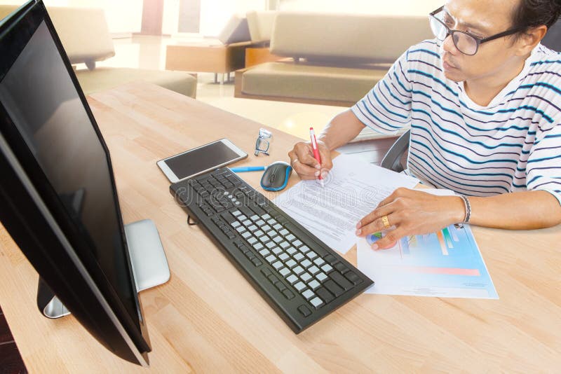 Man Working by Computer on Table at Home Living Room Stock Photo ...