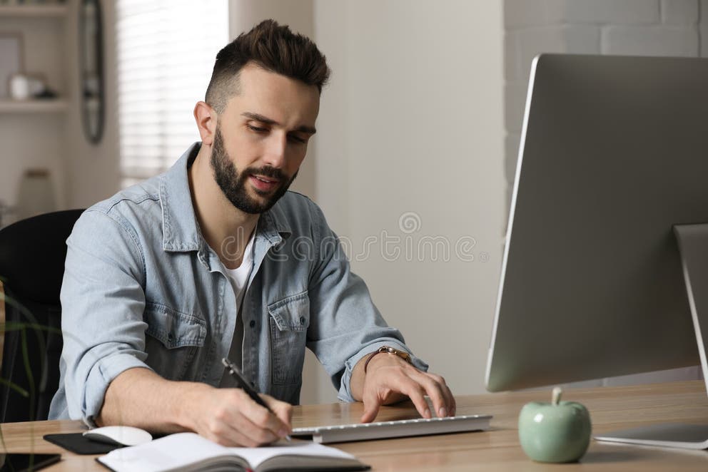Man Working with Computer at Table in Home Office Stock Photo - Image ...