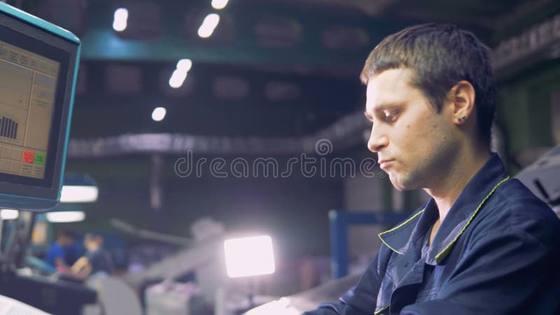 Man Working with Computerized Machine Operating with Factory Line at ...