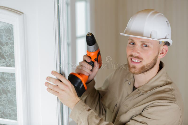 Man Working on Construction Site Stock Image - Image of drill, handyman ...