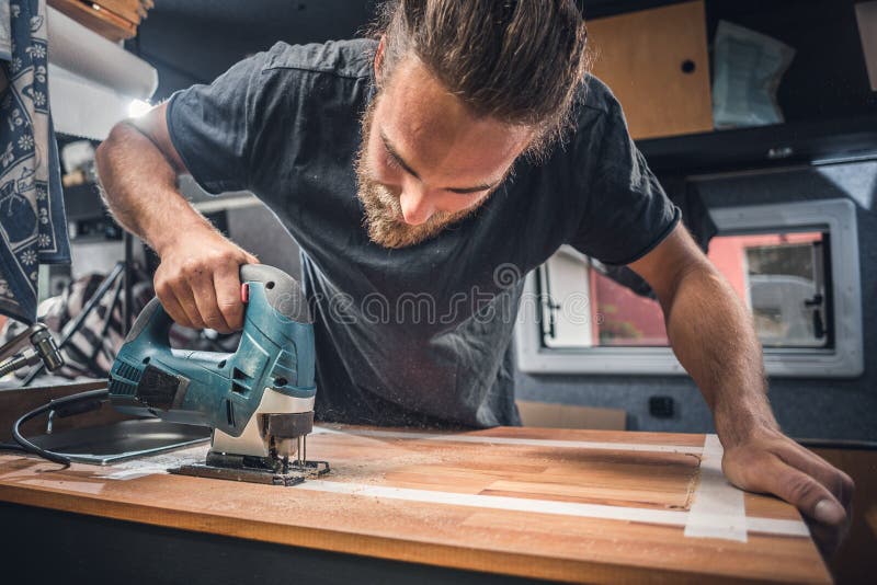 Man Working on the Countertop Inside a Camper Van Stock Image - Image ...