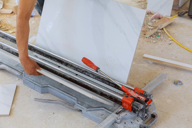 Manual Cutting of Ceramic Tiles on a Special Machine for Cutting Tiles ...