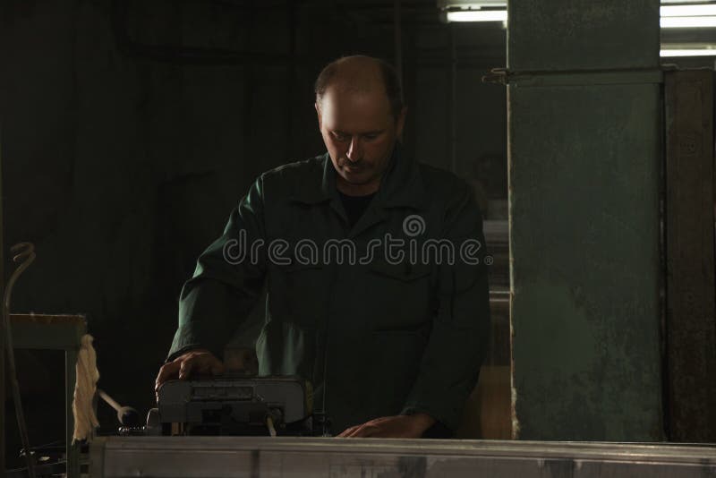 Man Working in Dark Factory Stock Image - Image of people, labor: 53957923