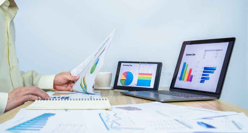 Man Working Data Graph Document Near Tablet, Laptop Stock Image - Image ...