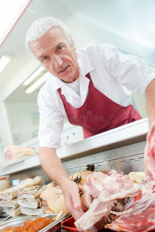 Man Working on Deli Counter Stock Photo - Image of meats, commerce ...