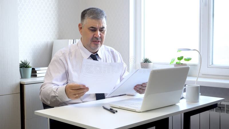 Man Working with Documents at Office Desk Stock Photo - Image of ...