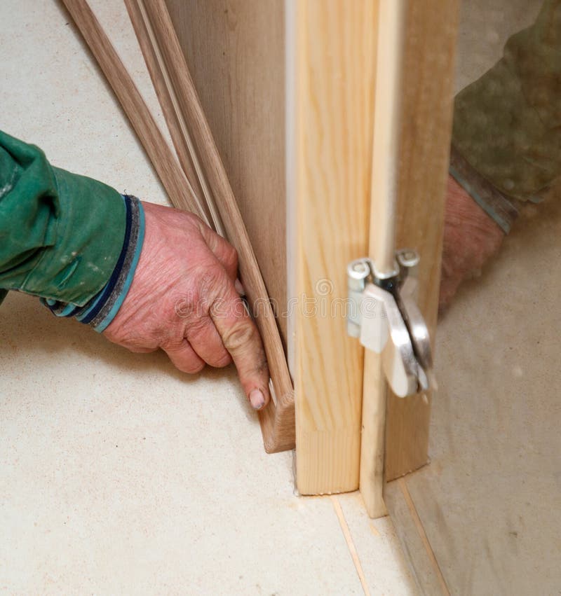 A man is working on a door stock photo. Image of repair - 357842212