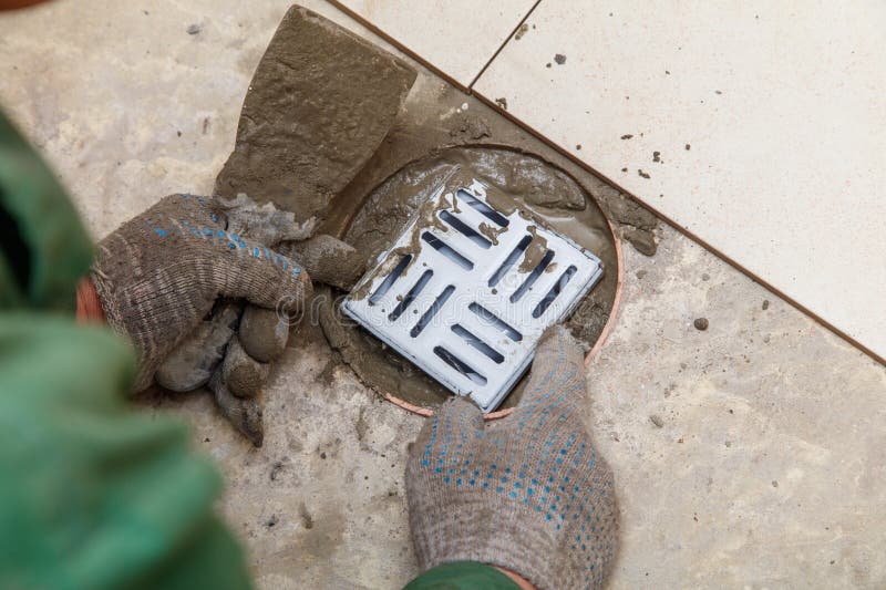 A Man is Working on a Drain with a Trowel Stock Image - Image of ...