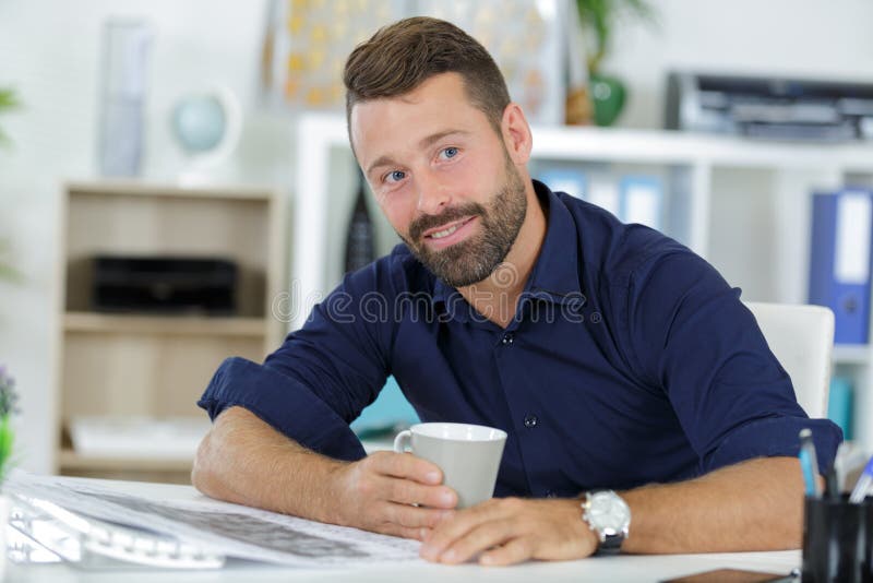 Man Working and Drinking Coffee in Office Stock Image - Image of cozy ...