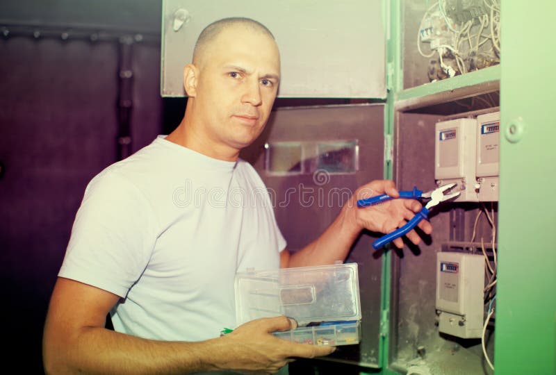 Man working with electric stock photo. Image of automatic - 89545620
