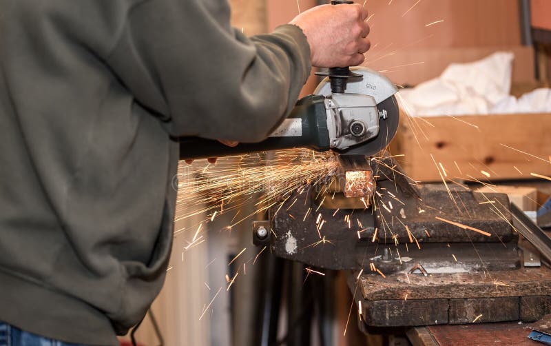 Man Working with Electric Grinder Tool on Steel Stock Image - Image of ...