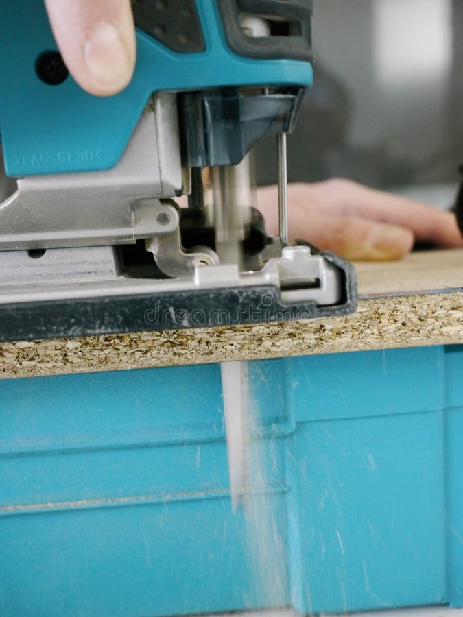 Man is Working with Electric Jig Saw Stock Image - Image of appliance ...