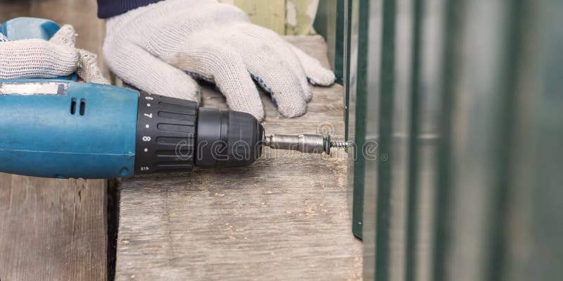 Man Working with an Electric Screwdriver , the Work of Modern Devices ...