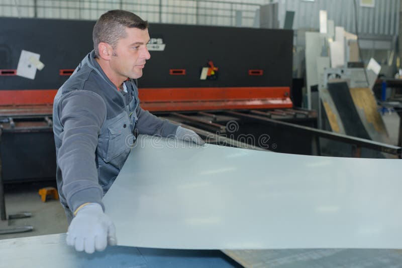 Man Working at Factory Manufacturing Tempered Clear Float Glass Stock ...