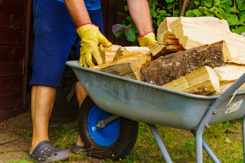 Man working with firewood stock photo. Image of cabin - 222736308