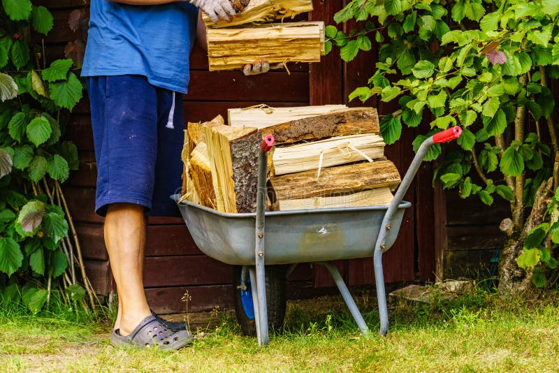 Man working with firewood stock image. Image of housework - 336472015
