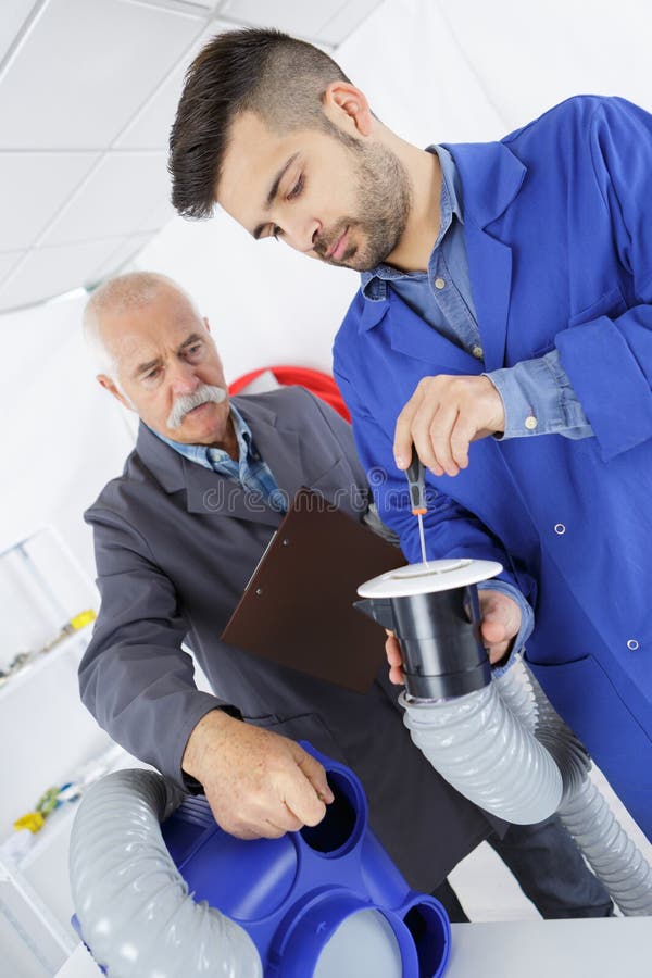 Man Working with Flexible Hose Stock Photo - Image of industry, senior ...