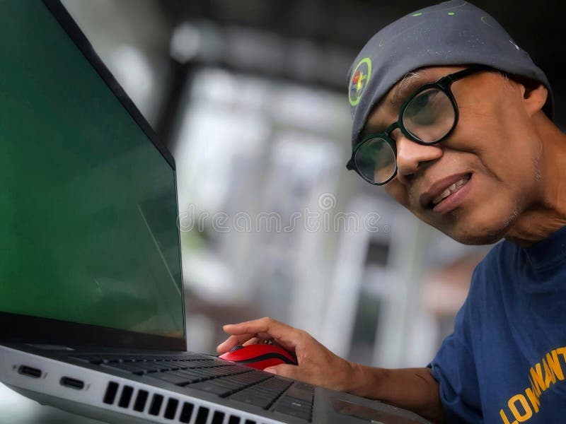 A Man Working in Front of Green Screen Laptop Stock Image - Image of ...