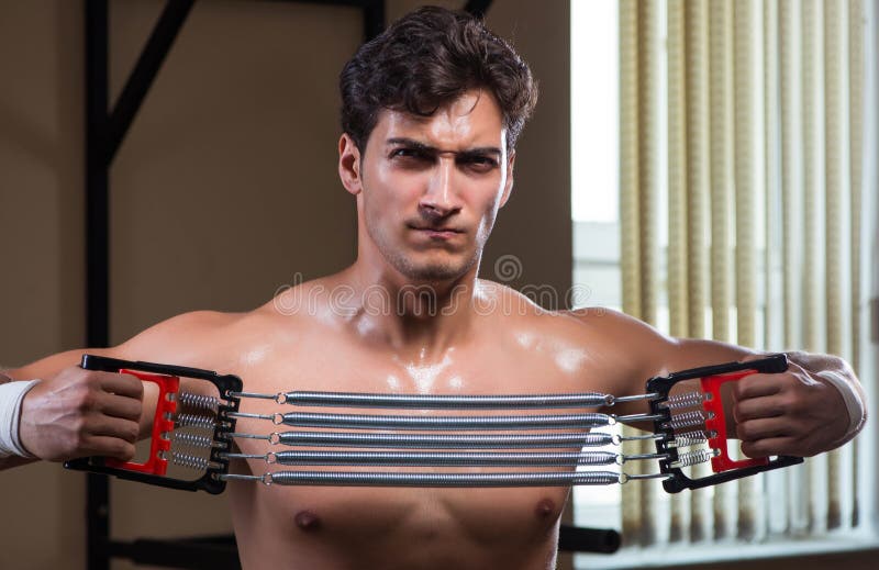 Man Working in the Gym with Springs Stock Image - Image of pulling ...