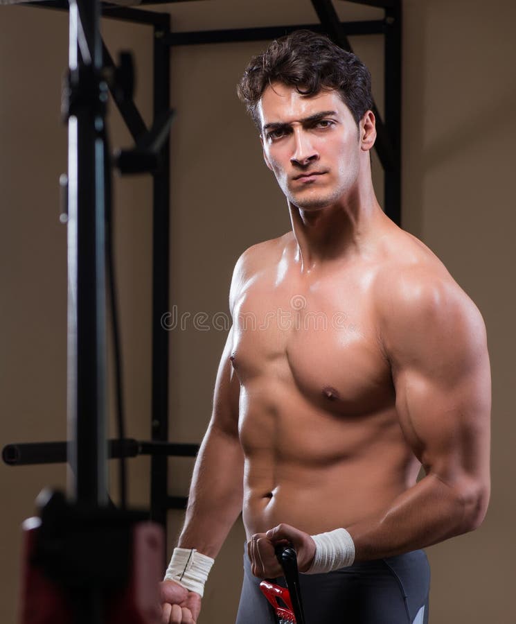 Man Working in the Gym with Springs Stock Photo - Image of pumping ...