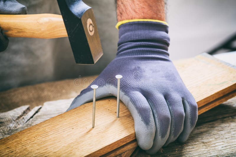 Man working with a hammer stock photo. Image of metal - 84258798