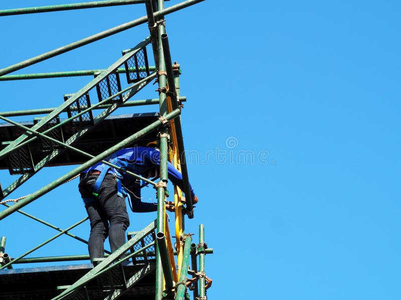 Man Working on the Working at Height on Construction Stock Photo ...