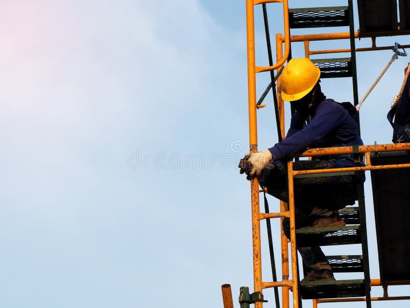 Man Working on the Working at Height on Construction Stock Photo ...