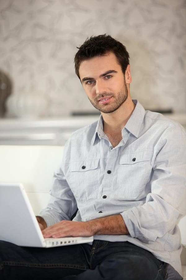 Man working on his laptop stock image. Image of laptop - 22920209