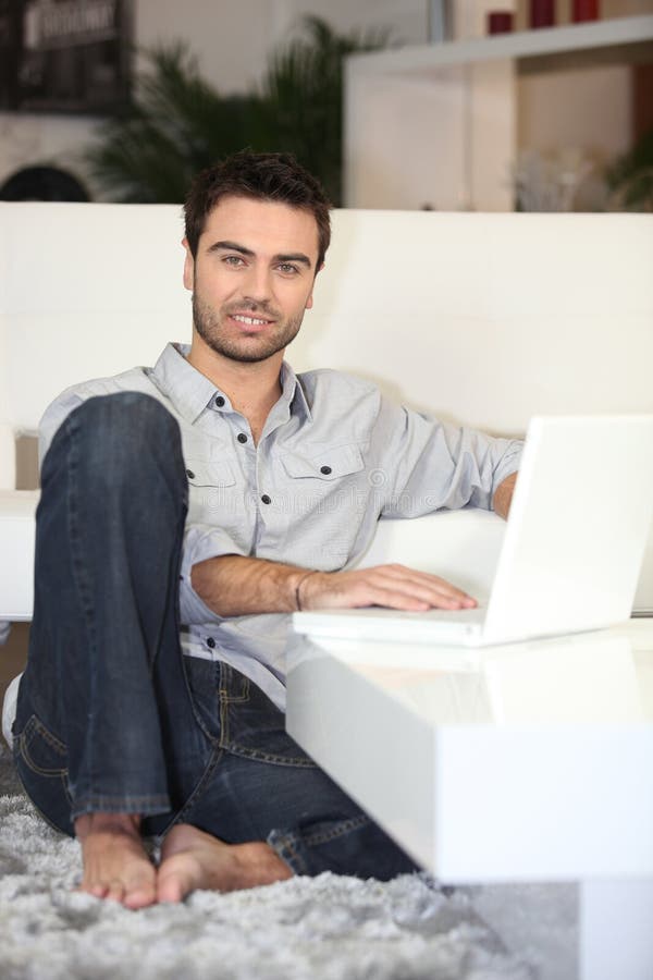 Man working on his laptop stock photo. Image of modern - 23862596
