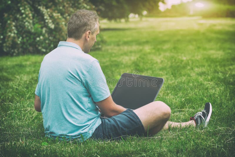 Man Working on His Laptop in the Park Stock Image - Image of lifestyle ...