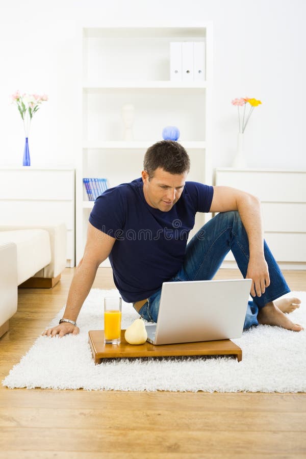 Man working at home stock photo. Image of browsing, color - 8556120