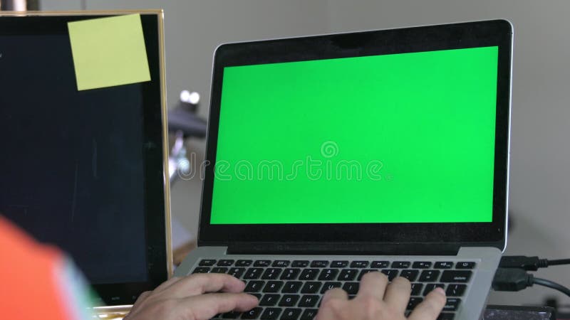Man Working at Home on Computer Laptop, Looking at Green Screen. Stock ...