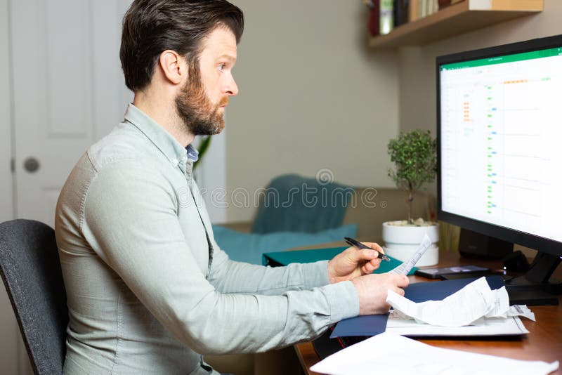 Man Working from Home on Desktop Computer with Paperwork. HD 24FPS ...