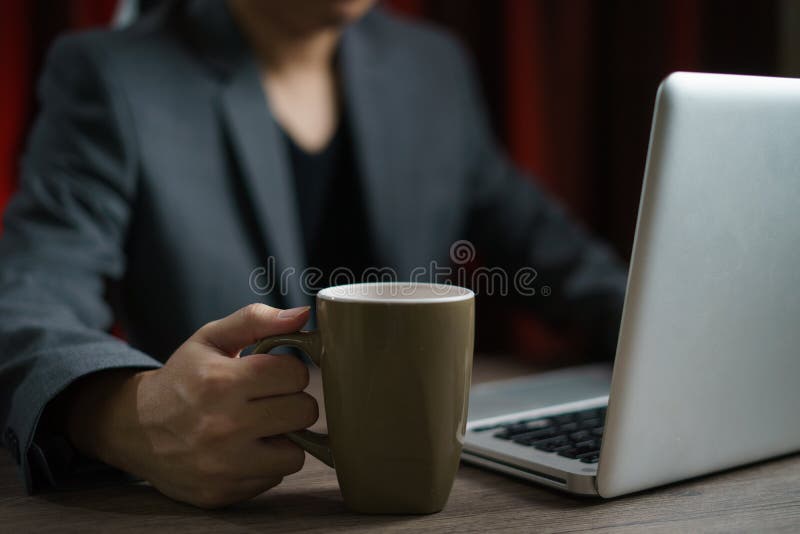 Man Working from Home Using Computer and Drinking Cup of Tea, Closeup ...