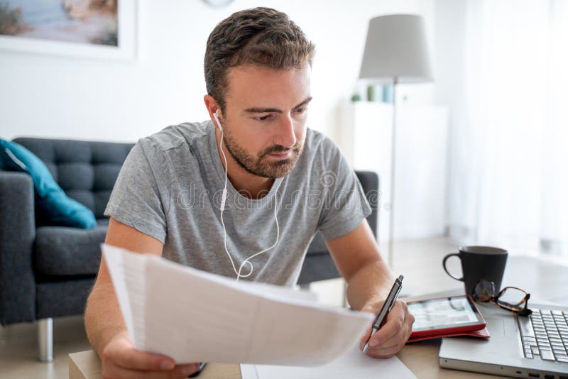 Man Working from Home Using Computer and Internet Connection Stock ...