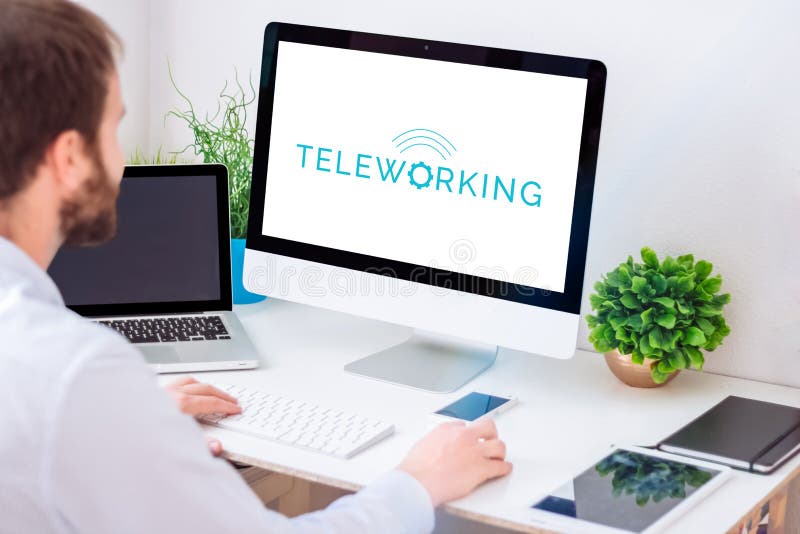 Man Working from Home Using Computer with Teleworking Logo on the ...