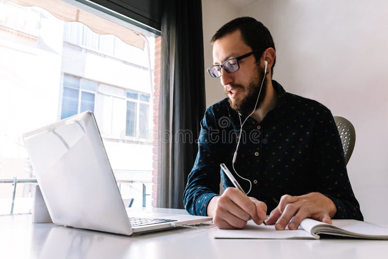 Man Working at Home and Writing Down His Plan of Action Stock Photo ...