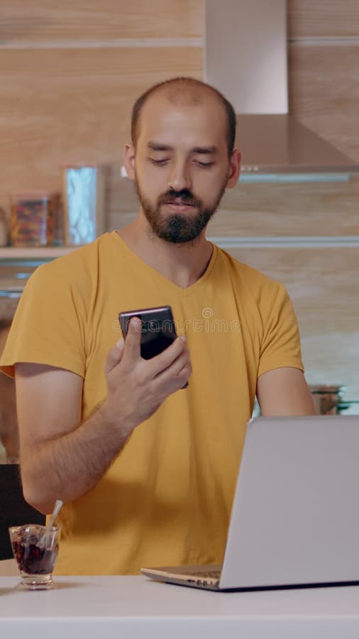Man Sitting in Kitchen Switch Off the Lights Using Voice Command Stock ...