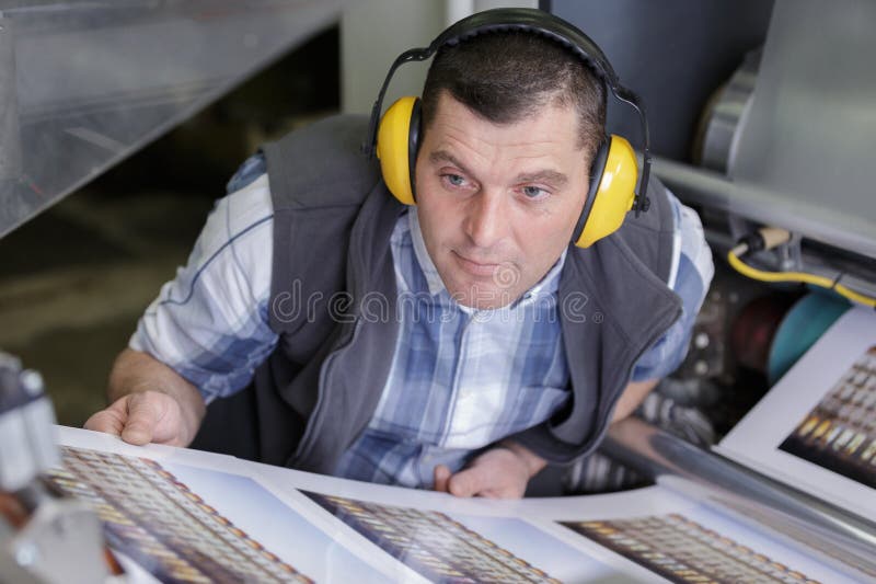 Man Working with Industrial Printer Stock Photo - Image of workplace ...