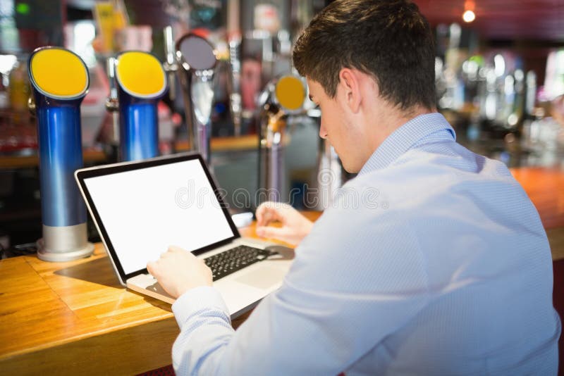 Man Working on Laptop at Bar Counter Stock Image - Image of lifestyle ...