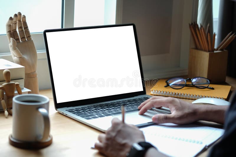 Man Working with Laptop Computer and Making Note on Notebook Stock ...