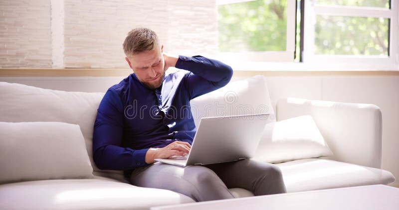 Man Working on Laptop Computer with Neck Injury Pain Stock Image ...